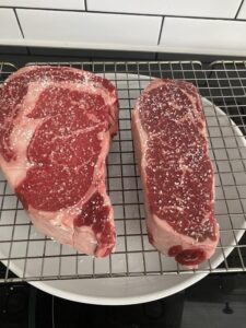 Ribeye vs. Striploin: A Tasty Confrontation - Bloomers Bar & Grill